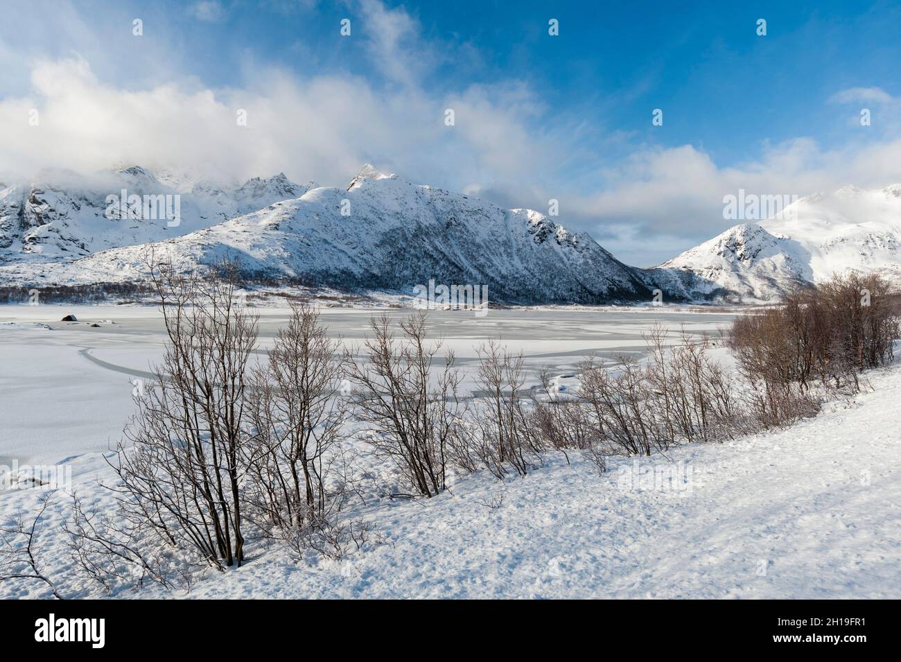 A scenic and snowy view of a frozen fjord near Svolvaer. Svolvaer ...