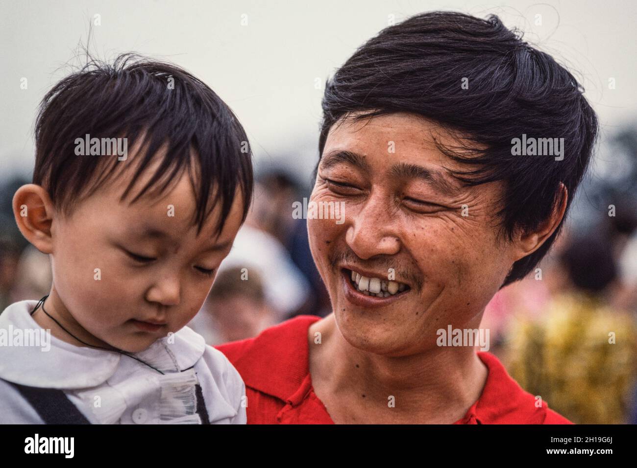 A Chinese father smiles at his young son in Beijing, China Stock Photo ...