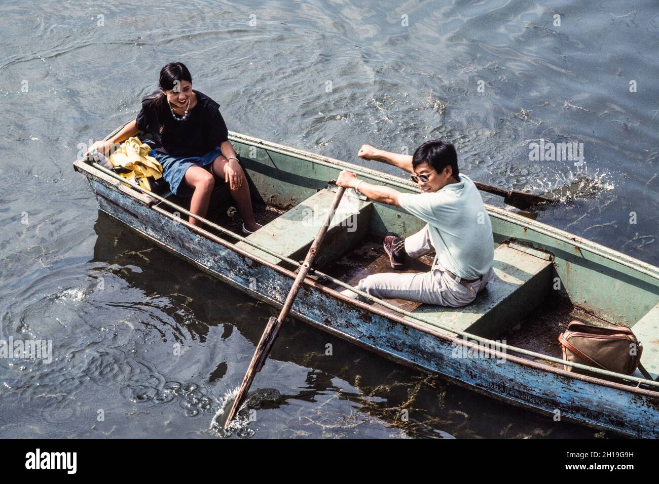 A young Chinese couple in a rowboat on Kunming Lake. Summer Palace ...