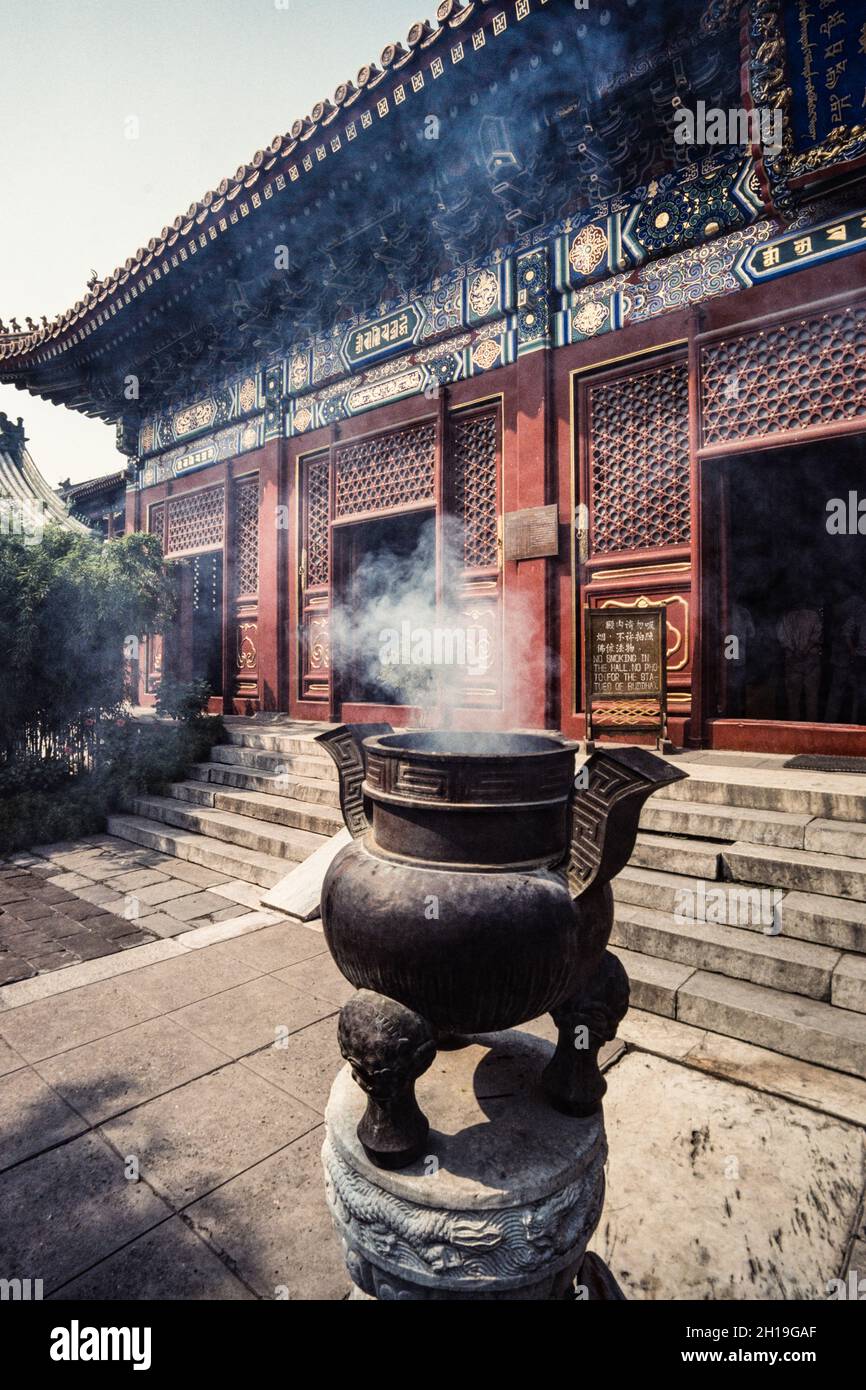 A large bronze censor of incense burner in front of the Lama Temple, a ...