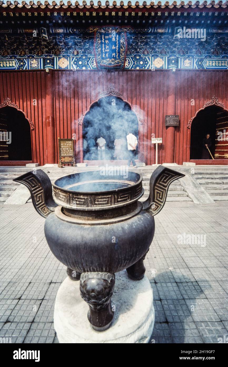 A large bronze censor of incense burner in front of the Lama Temple, a ...