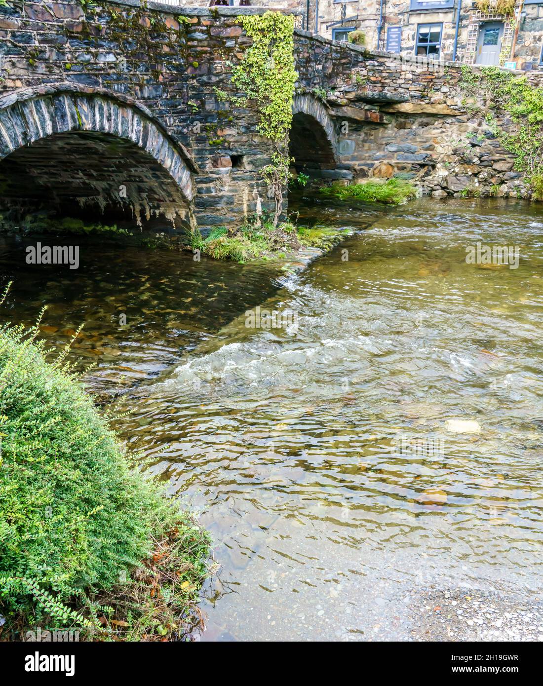 a two arch stone bridge constructed over a river in 1871 in the scenic ...