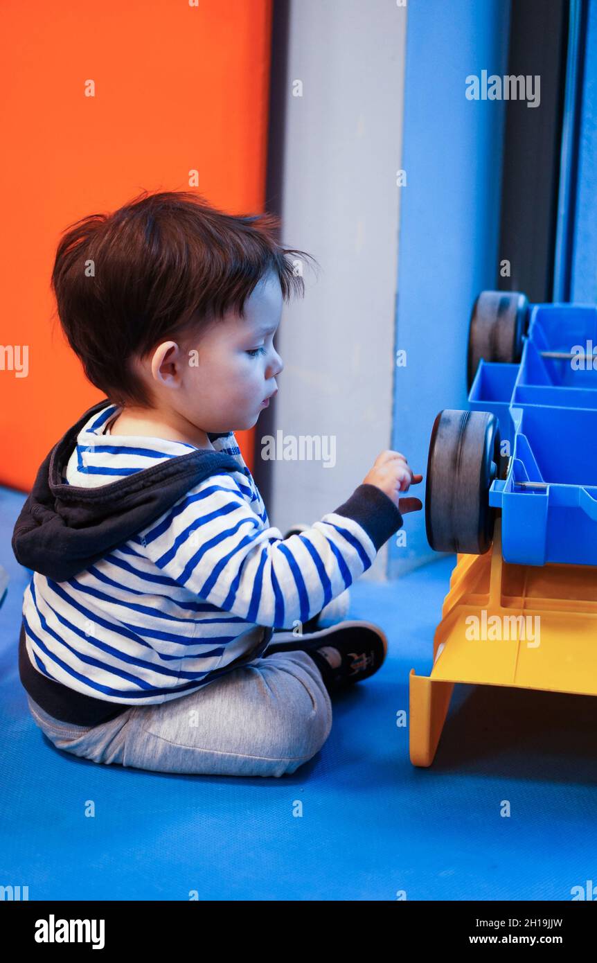 A young adorable Polish child playing in the indoor playground Stock ...