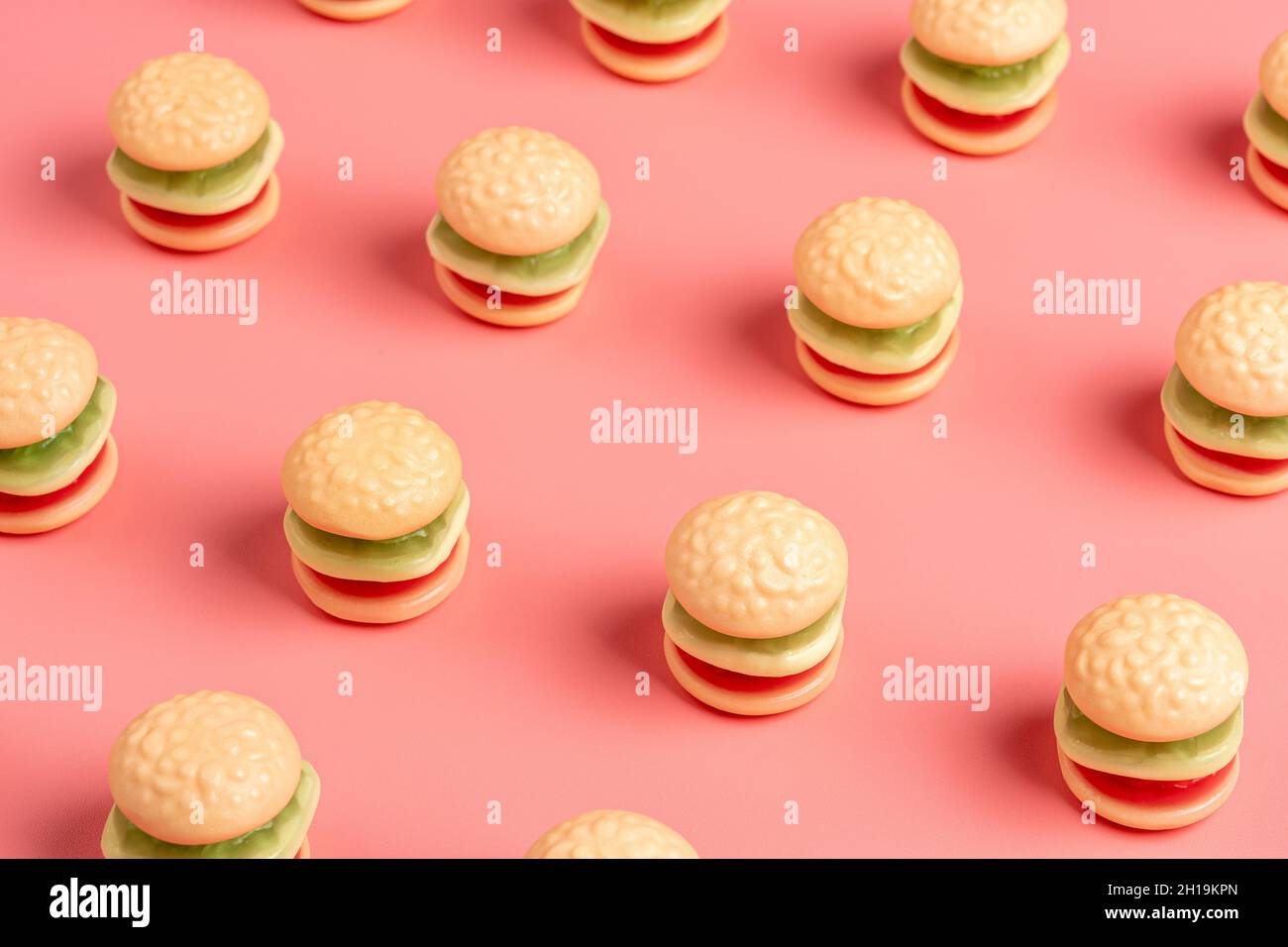 Colorful candy hamburgers on pink background. Minimal food concept ...