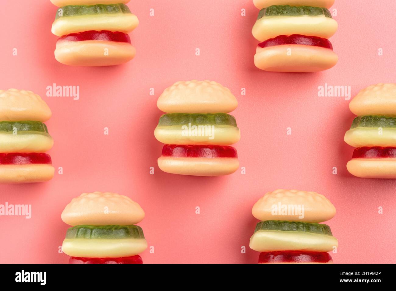 Colorful candy hamburgers on pink background. Minimal food concept ...