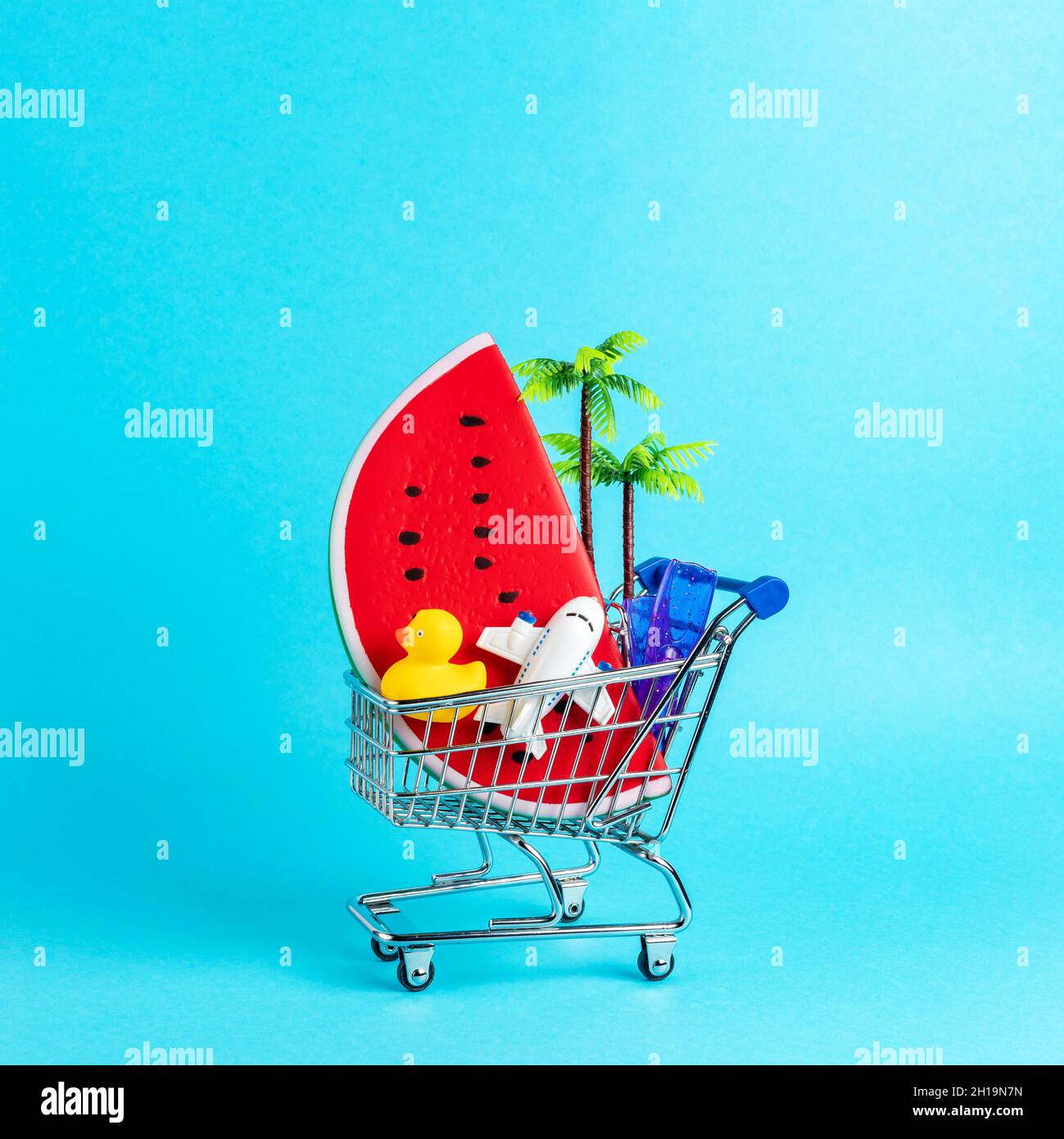 Tropical beach concept made with summer things in shopping troley on ...