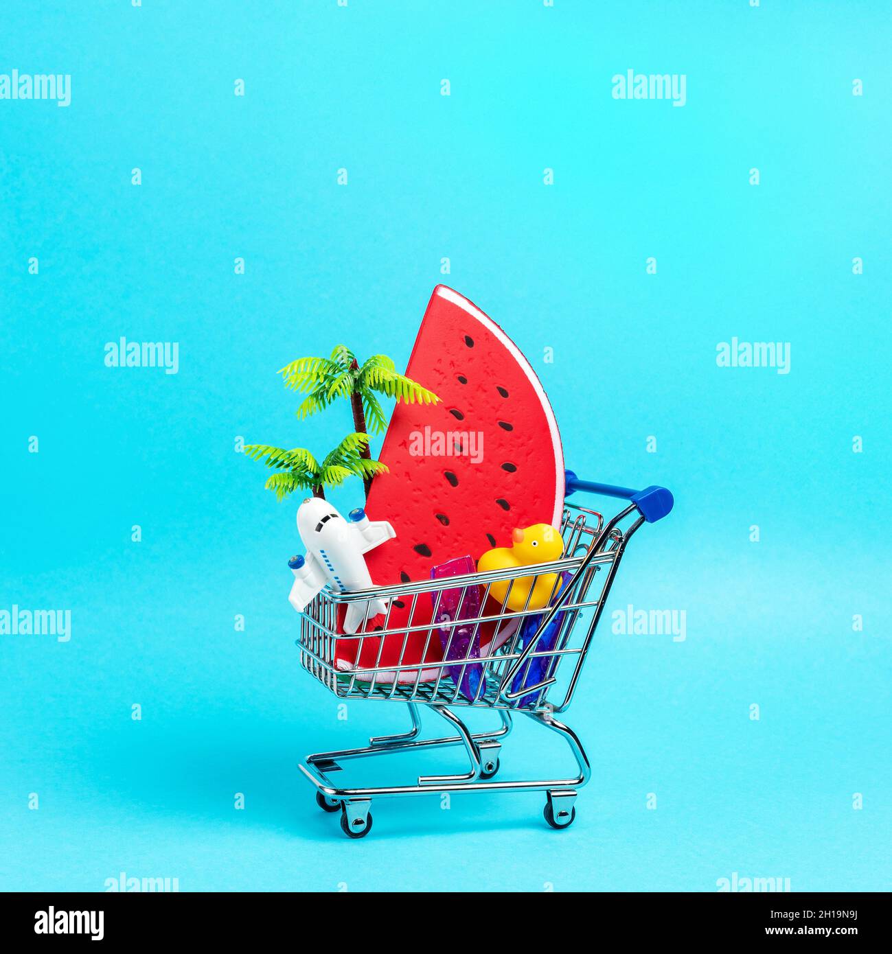 Tropical beach concept made with summer things in shopping troley on ...