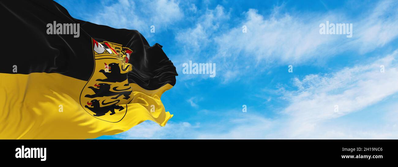 Flag Of Baden Wurttemberg State Greater Arms At Cloudy Sky Background