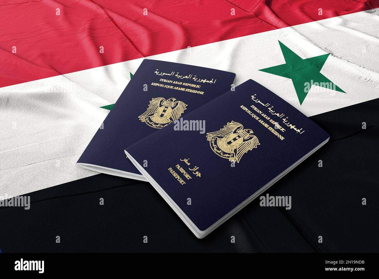 Syria passport on the Syrian flag, top view Stock Photo - Alamy