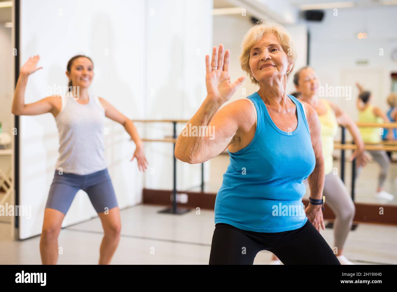 Old lady dancing in studio with women Stock Photo - Alamy
