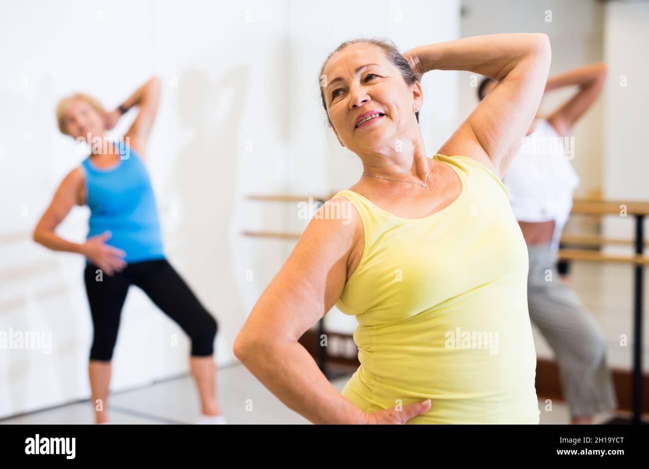 Old lady dancing with group in studio Stock Photo - Alamy