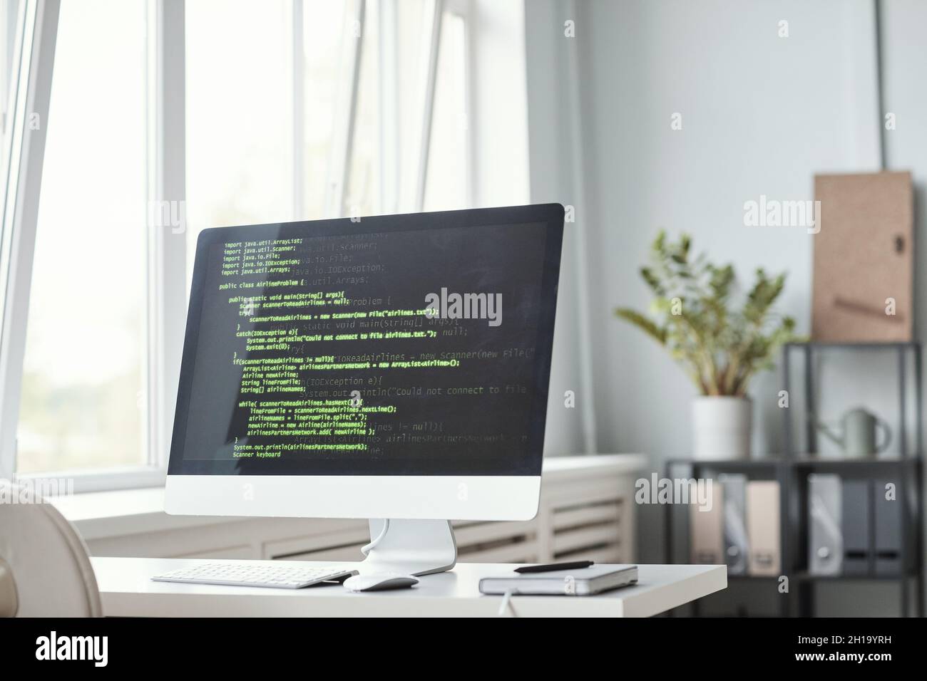 Background image of PC screen with green code lines on desk in software ...