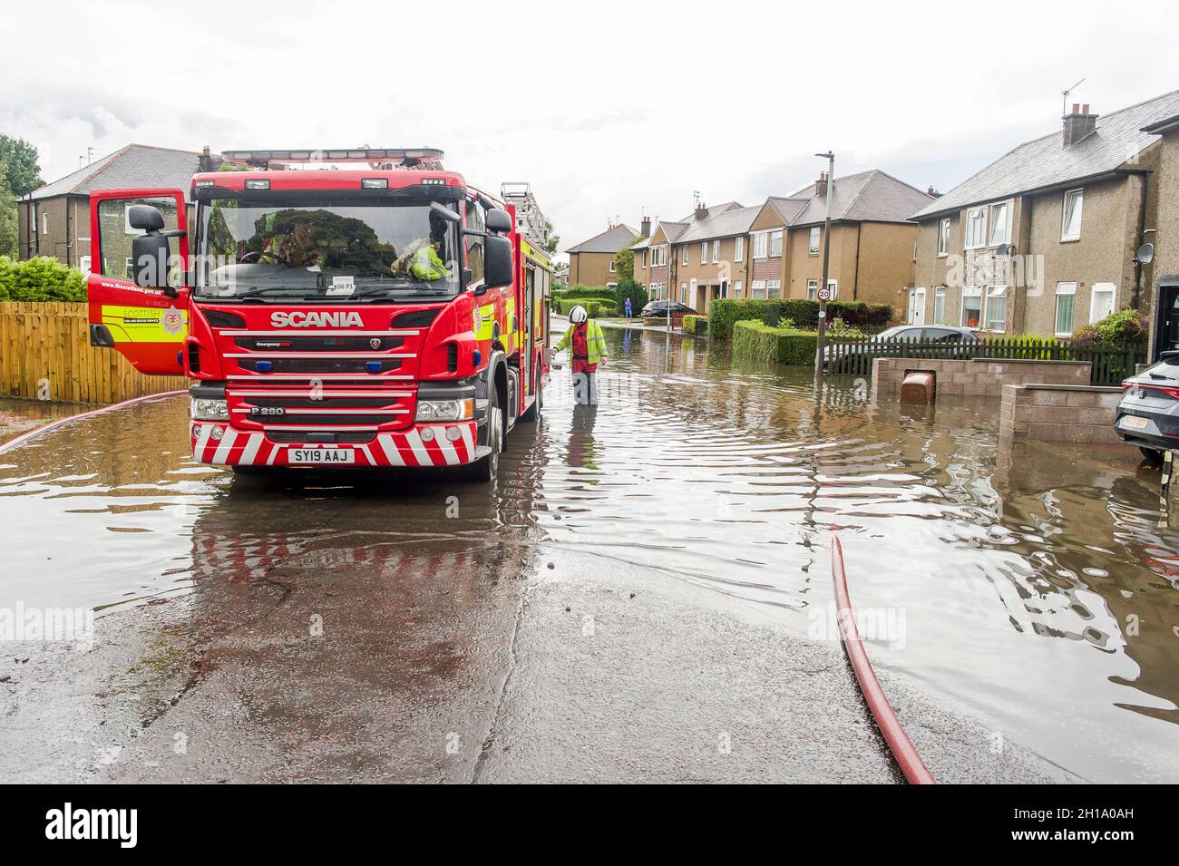 Broomfield Crescent in Edinburgh is flooded after heavy rainfall ...