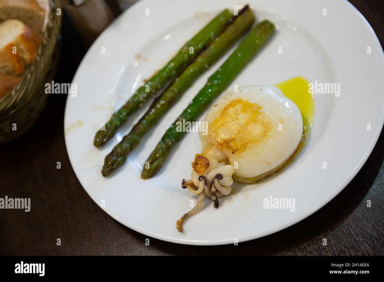 Grilled cuttlefish with baked asparagus Stock Photo - Alamy