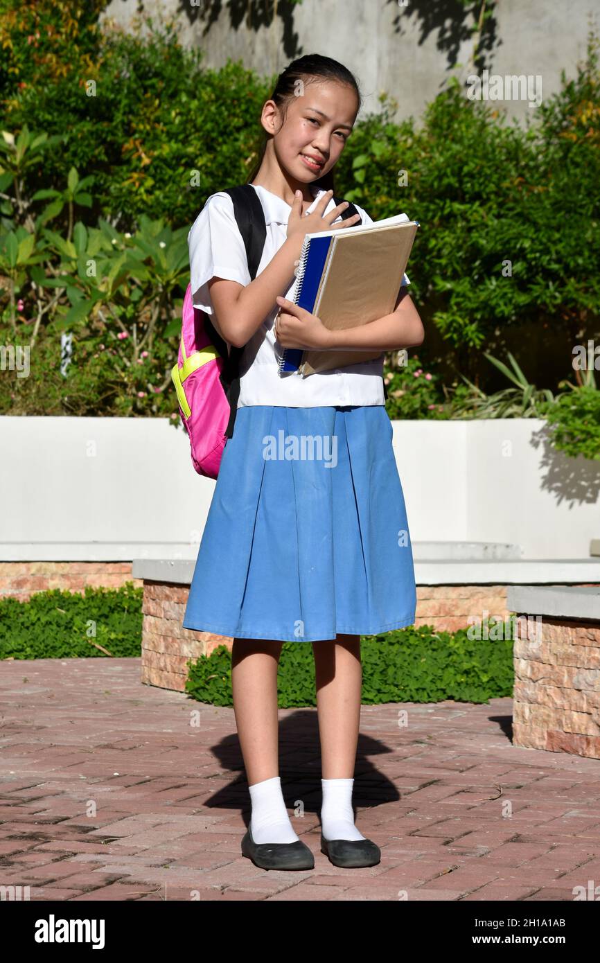 Female Student And Hope With School Books Standing Stock Photo - Alamy