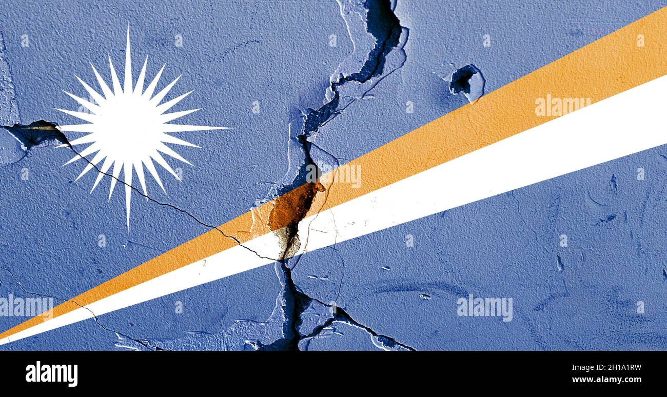 The Republic of Marshall Islands flag painted on broken wall background ...
