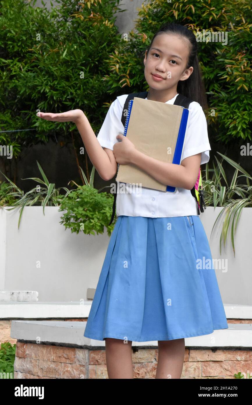 Youthful Diverse Girl Student Making A Decision With Books Standing ...