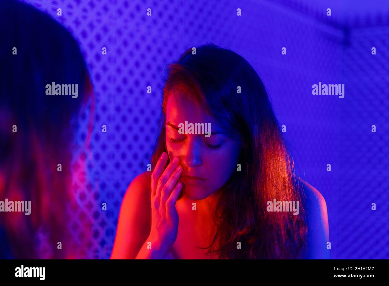 Mirror reflection of Sad tired woman in depression stress in bathroom ...