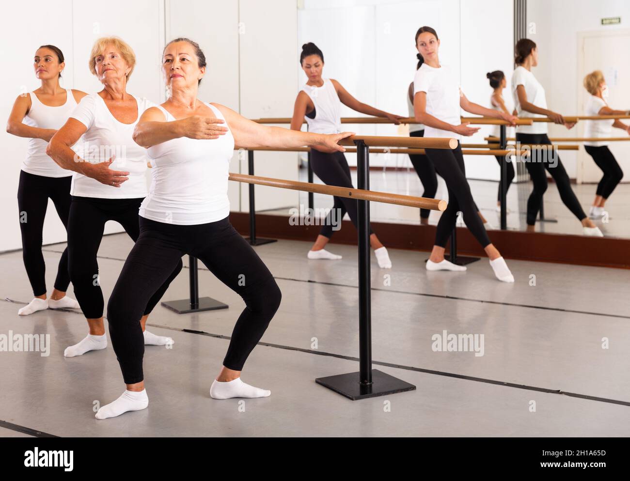 Ballet troupe of different ages in lesson in dance class Stock Photo ...