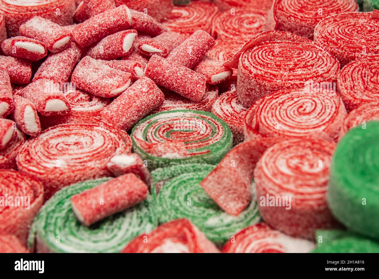 Set of red and green rolled chewing candies, close up Stock Photo - Alamy