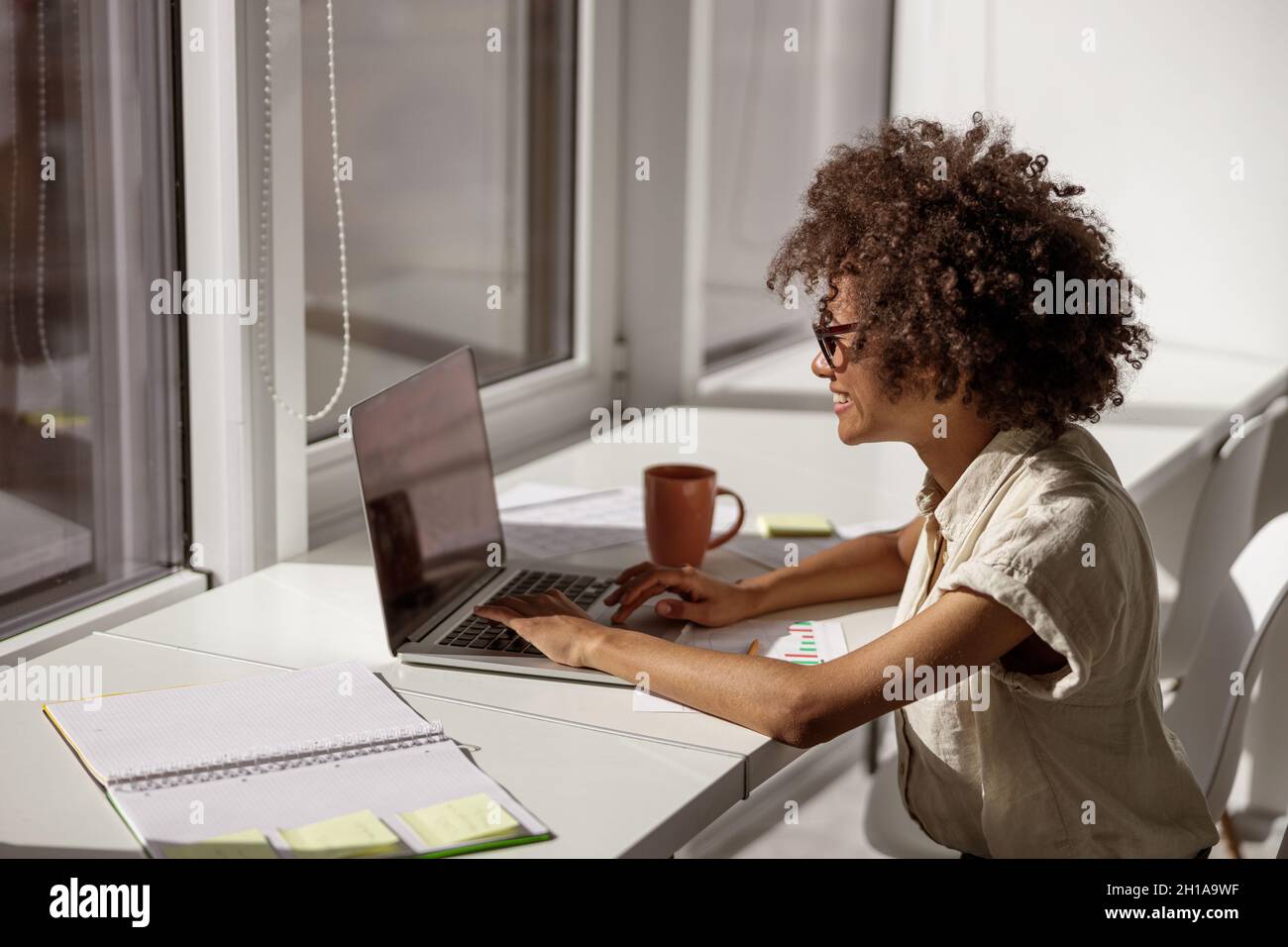 African American woman concentrated looking at computer screen Stock ...