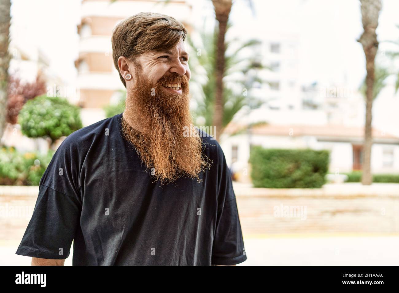 Young irish man smiling happy standing at the city Stock Photo - Alamy