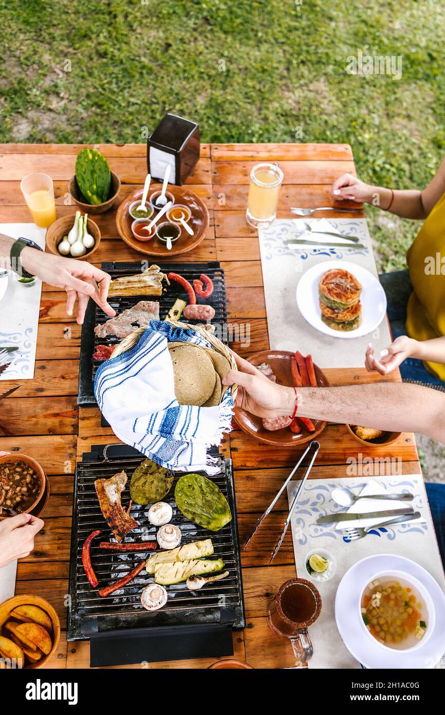 group of Friend eating Mexican Tacos and traditional food, snacks and ...