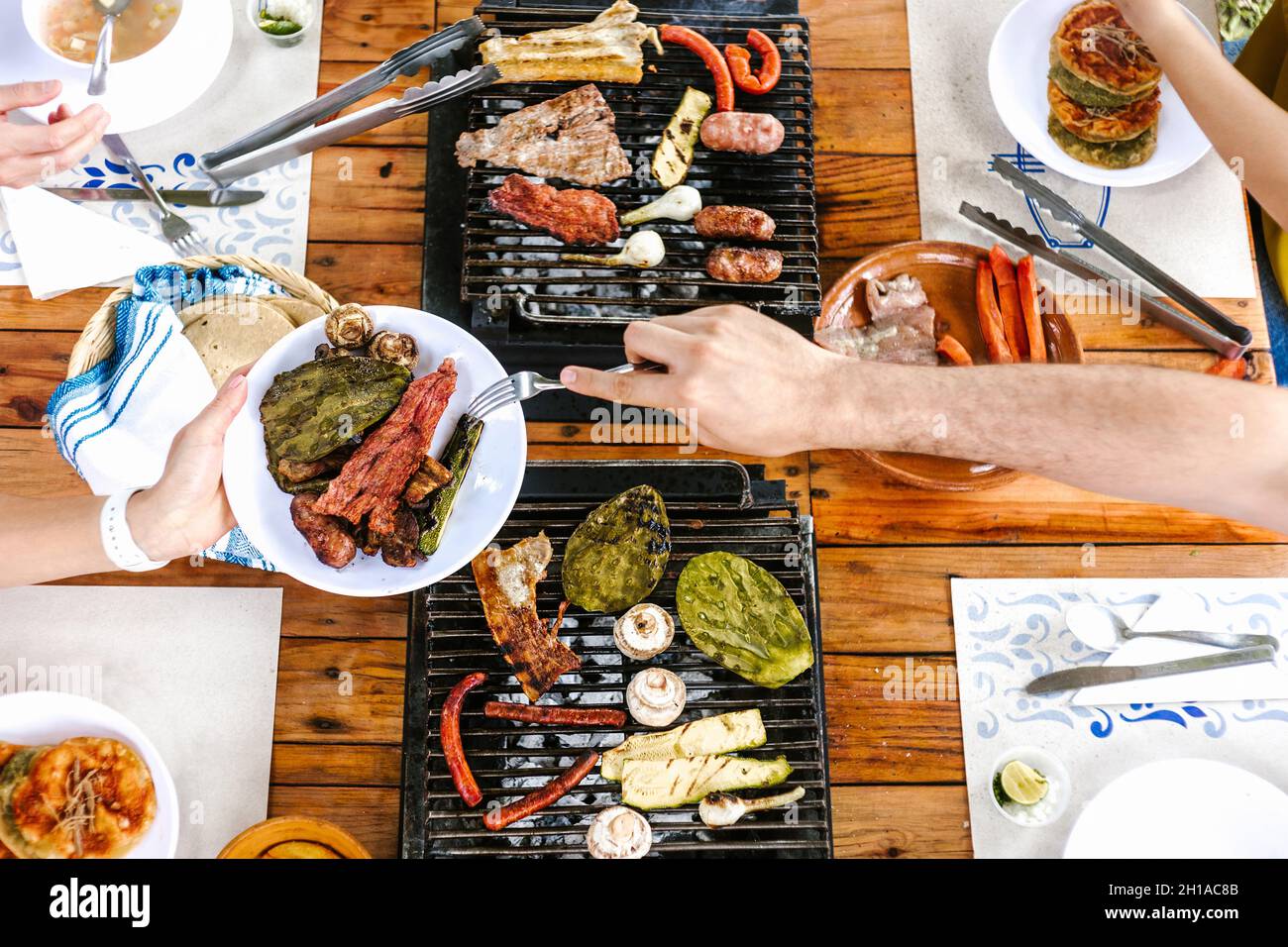 group of Friend eating Mexican Tacos and traditional food, snacks and ...