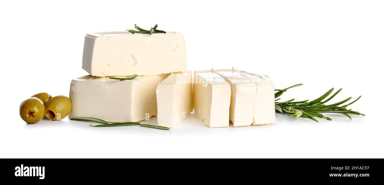 Cut feta cheese, rosemary and olives on white background Stock Photo ...