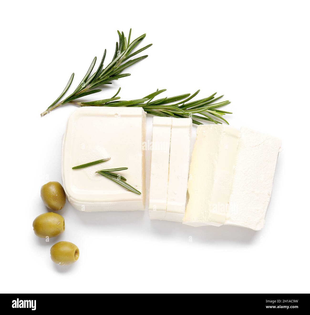 Cut feta cheese, rosemary and olives on white background Stock Photo ...