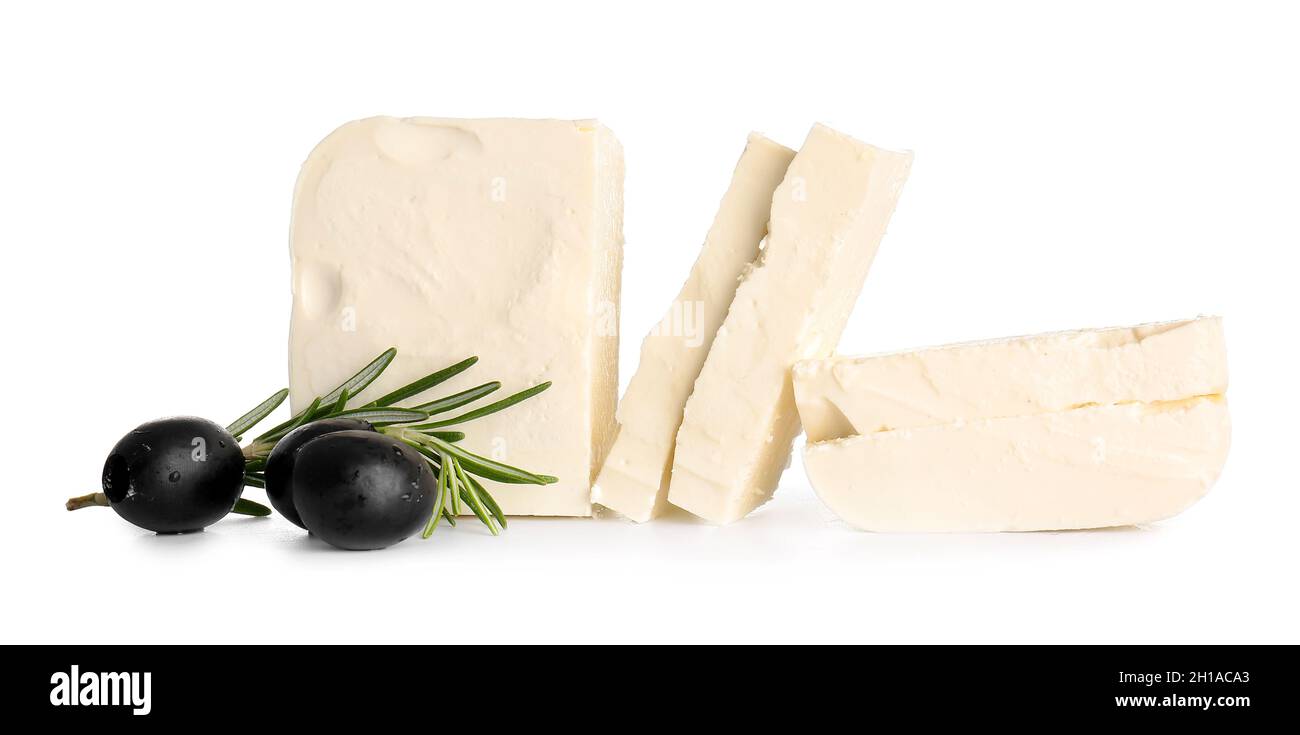 Cut feta cheese, rosemary and olives on white background Stock Photo ...