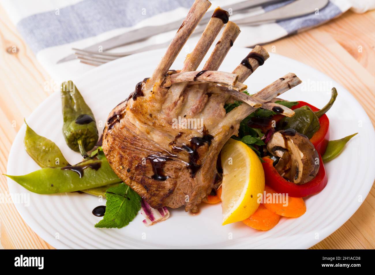 BBQ lamb carre served with vegetables Stock Photo - Alamy
