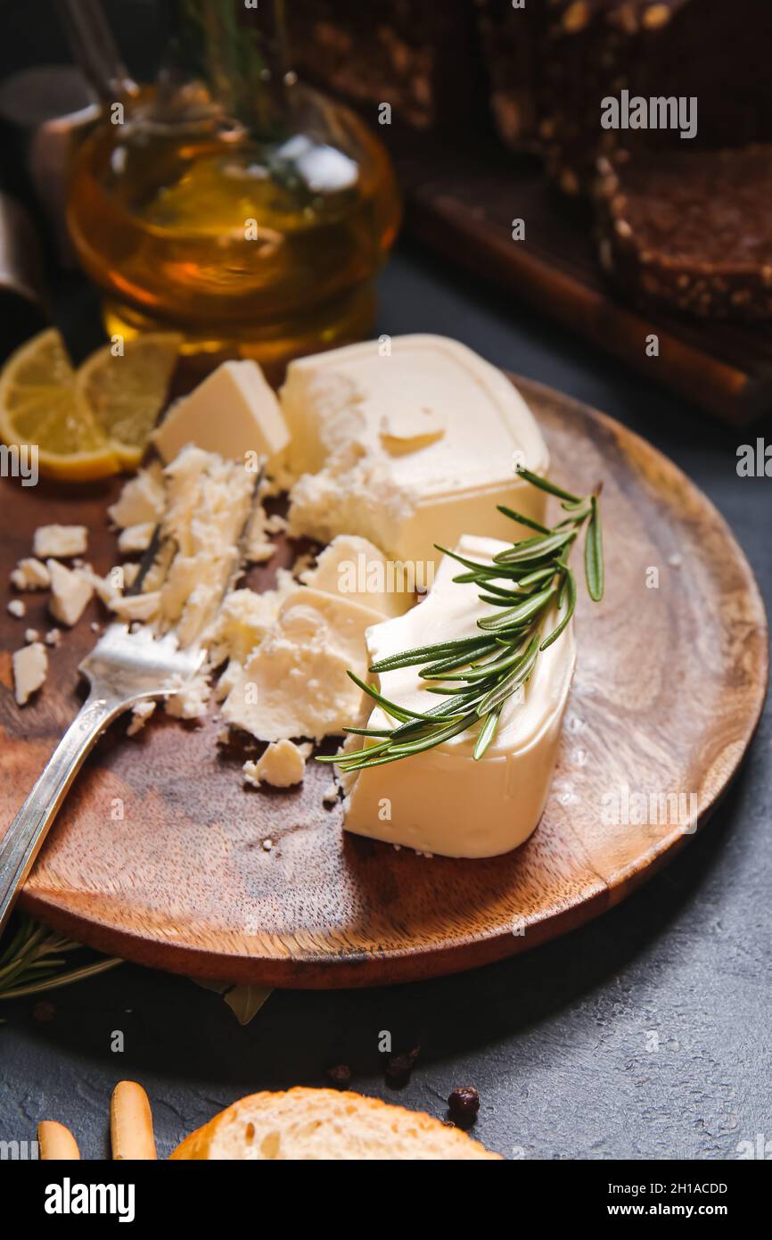 Plate and fork with crushed feta cheese on dark background Stock Photo ...