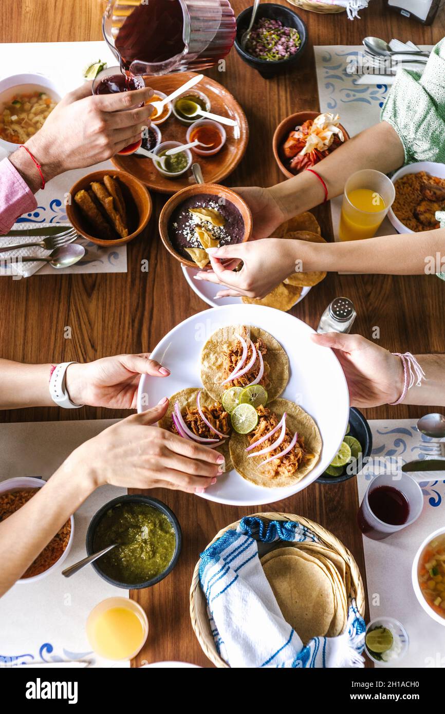 group of Friend eating Mexican Tacos and traditional food, snacks and ...