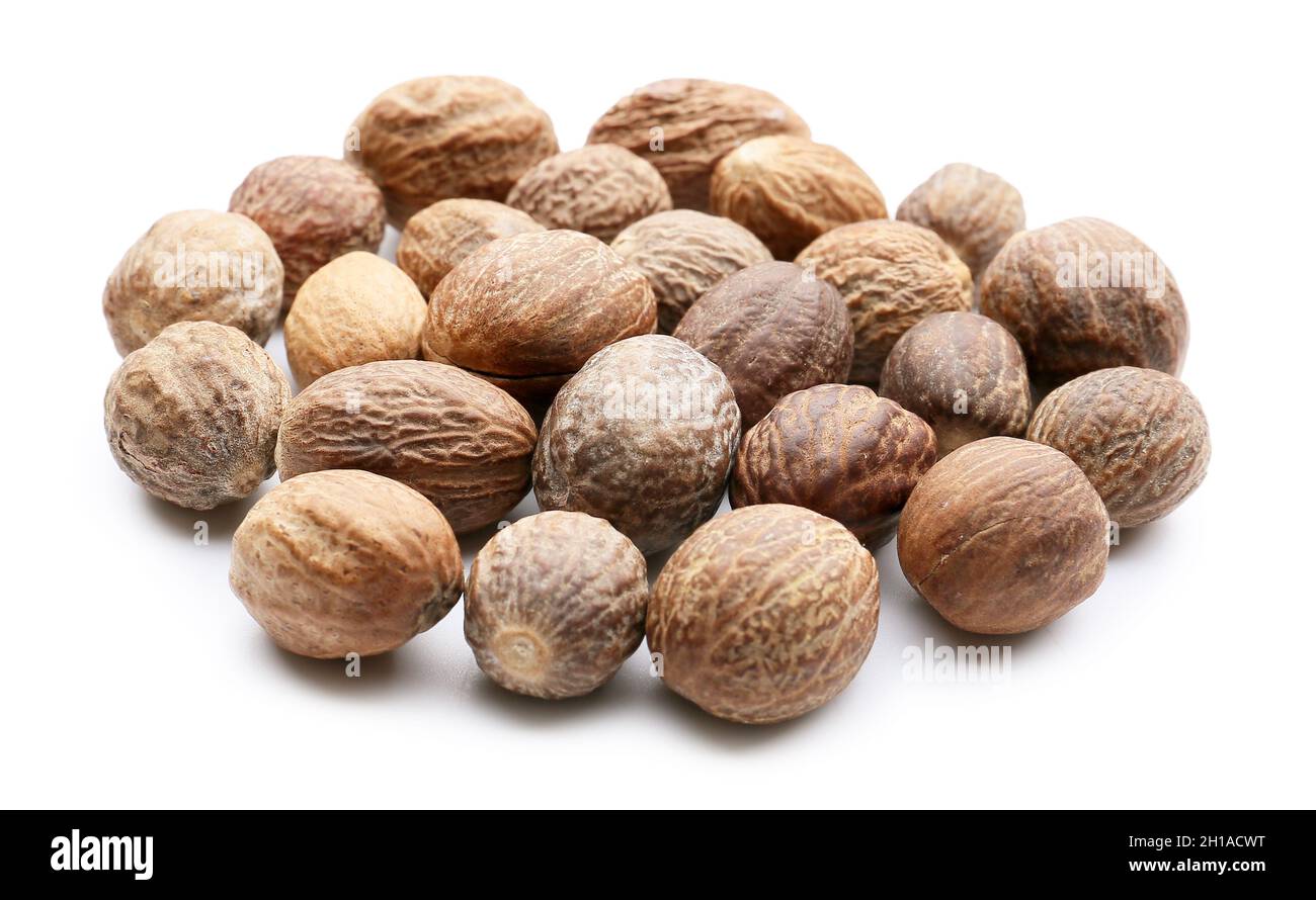 Heap of shea nuts on white background Stock Photo - Alamy