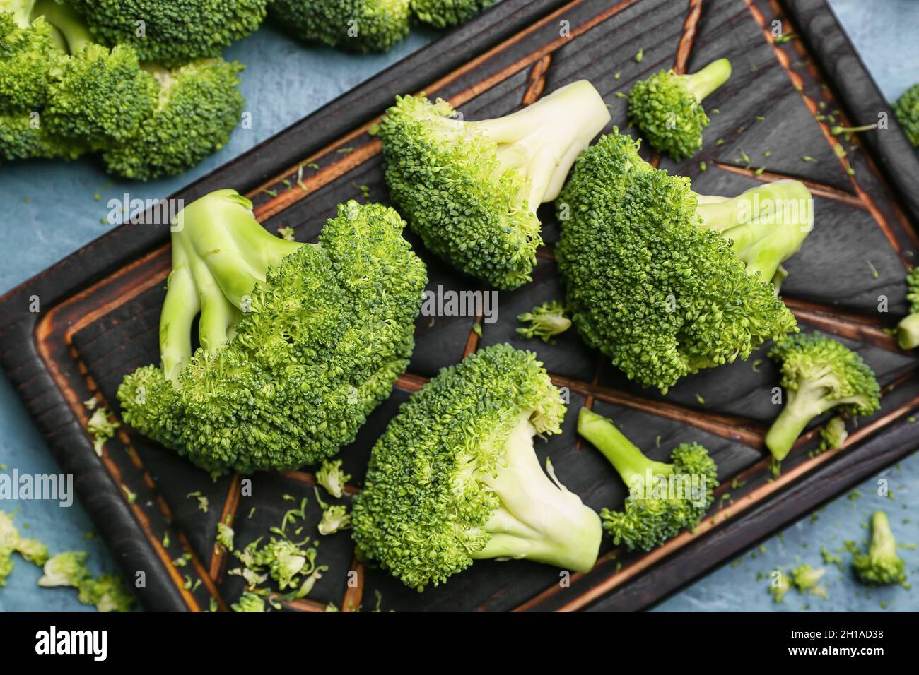 Board with healthy broccoli cabbage on color background Stock Photo - Alamy