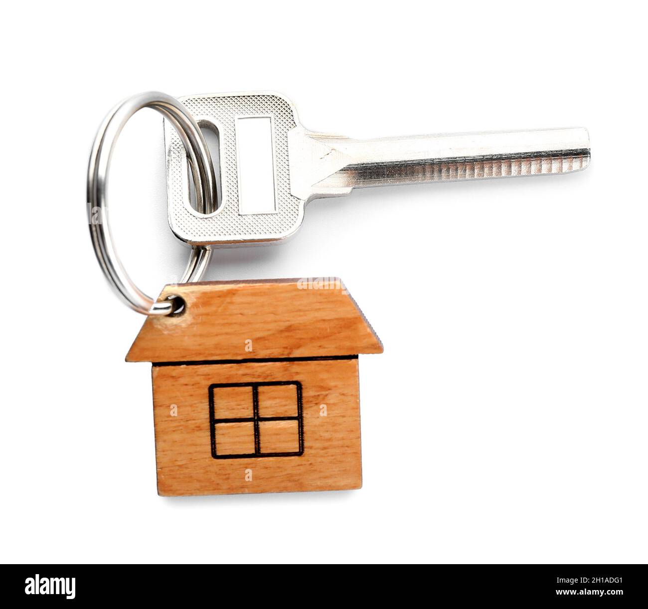 Key and wooden house shaped keychain on white background Stock Photo ...