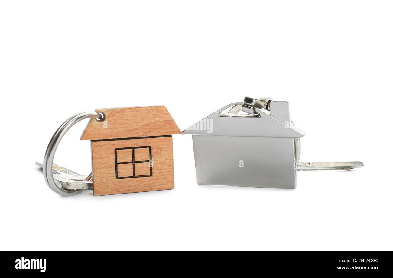 Home keys with house shaped keychains on white background Stock Photo ...