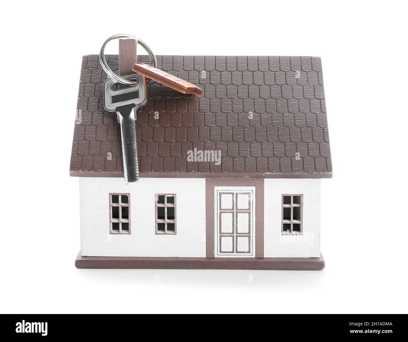 Model of house with key and keychain on white background Stock Photo ...