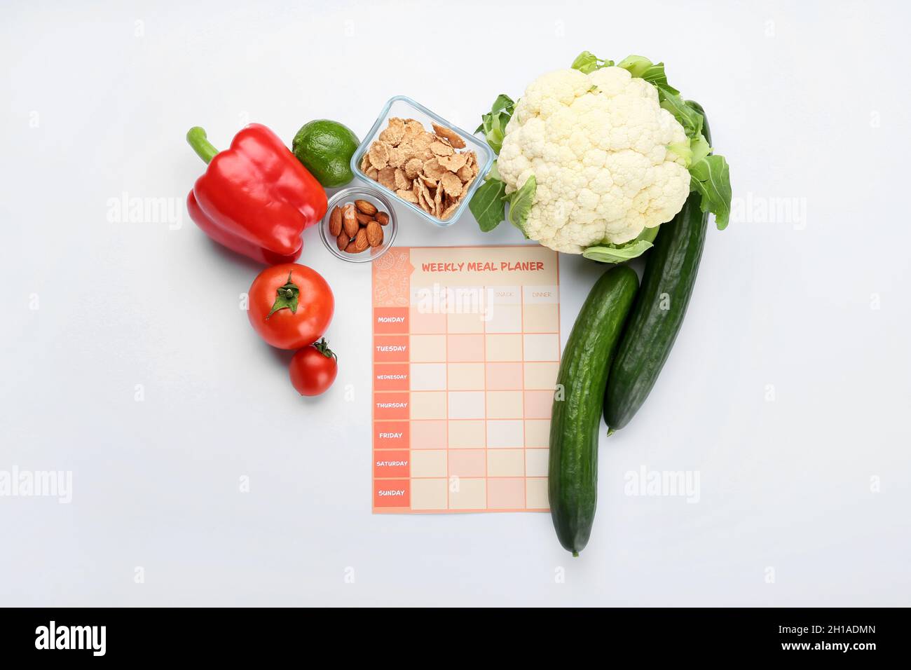 Healthy products with meal plan on white background Stock Photo - Alamy
