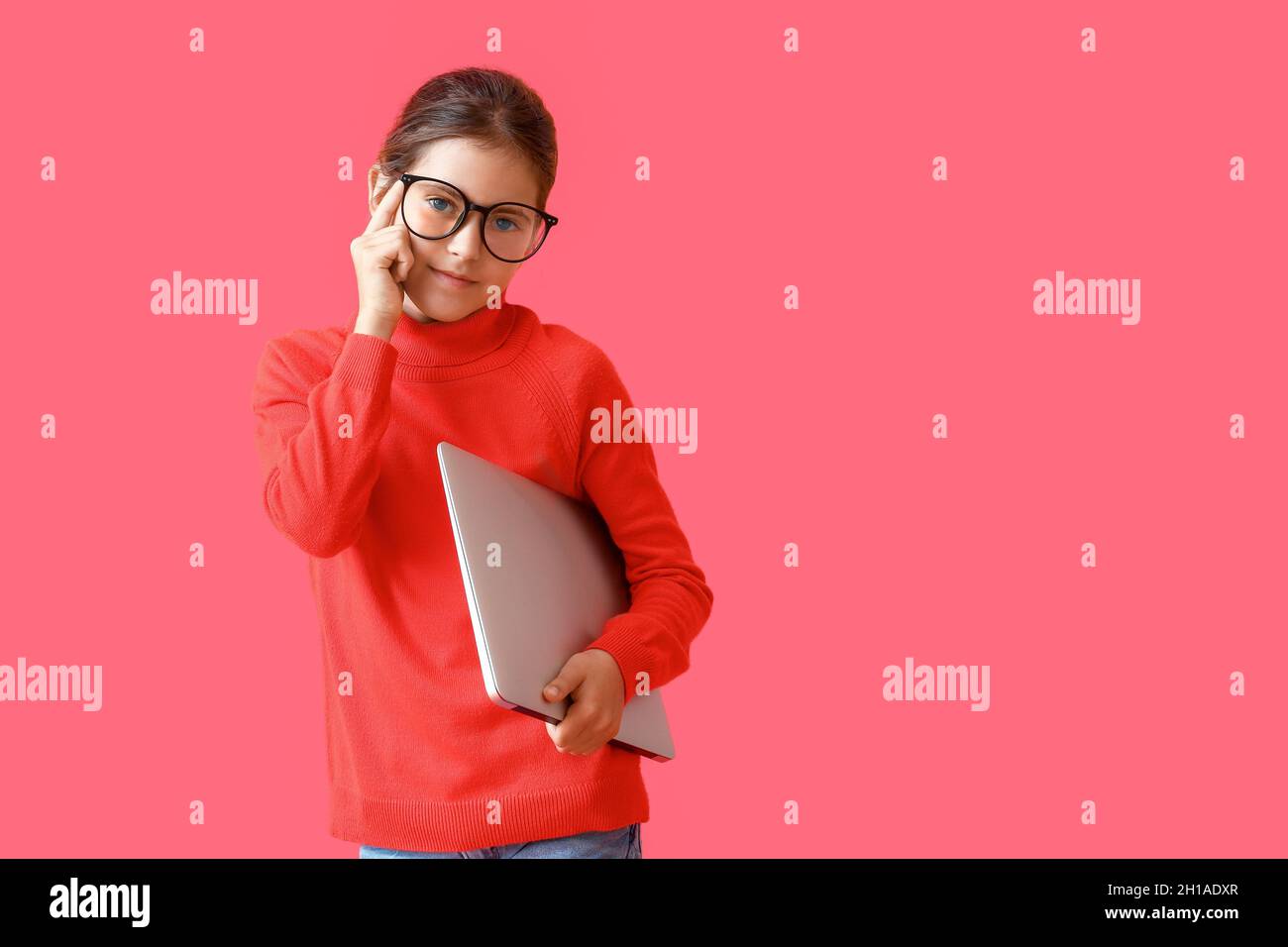 Little programmer with laptop on color background Stock Photo - Alamy