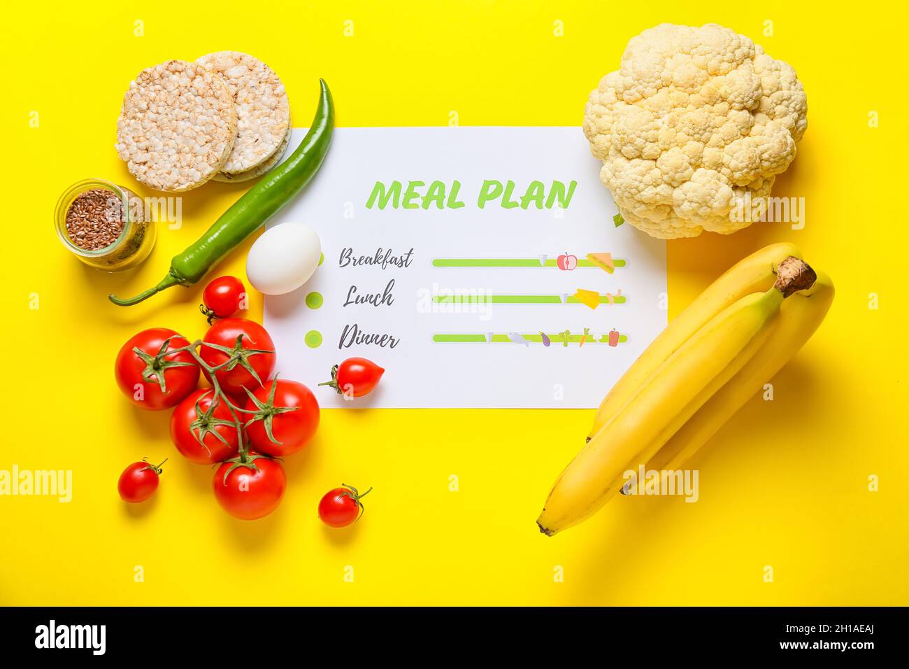 Healthy products and meal plan on yellow background Stock Photo - Alamy