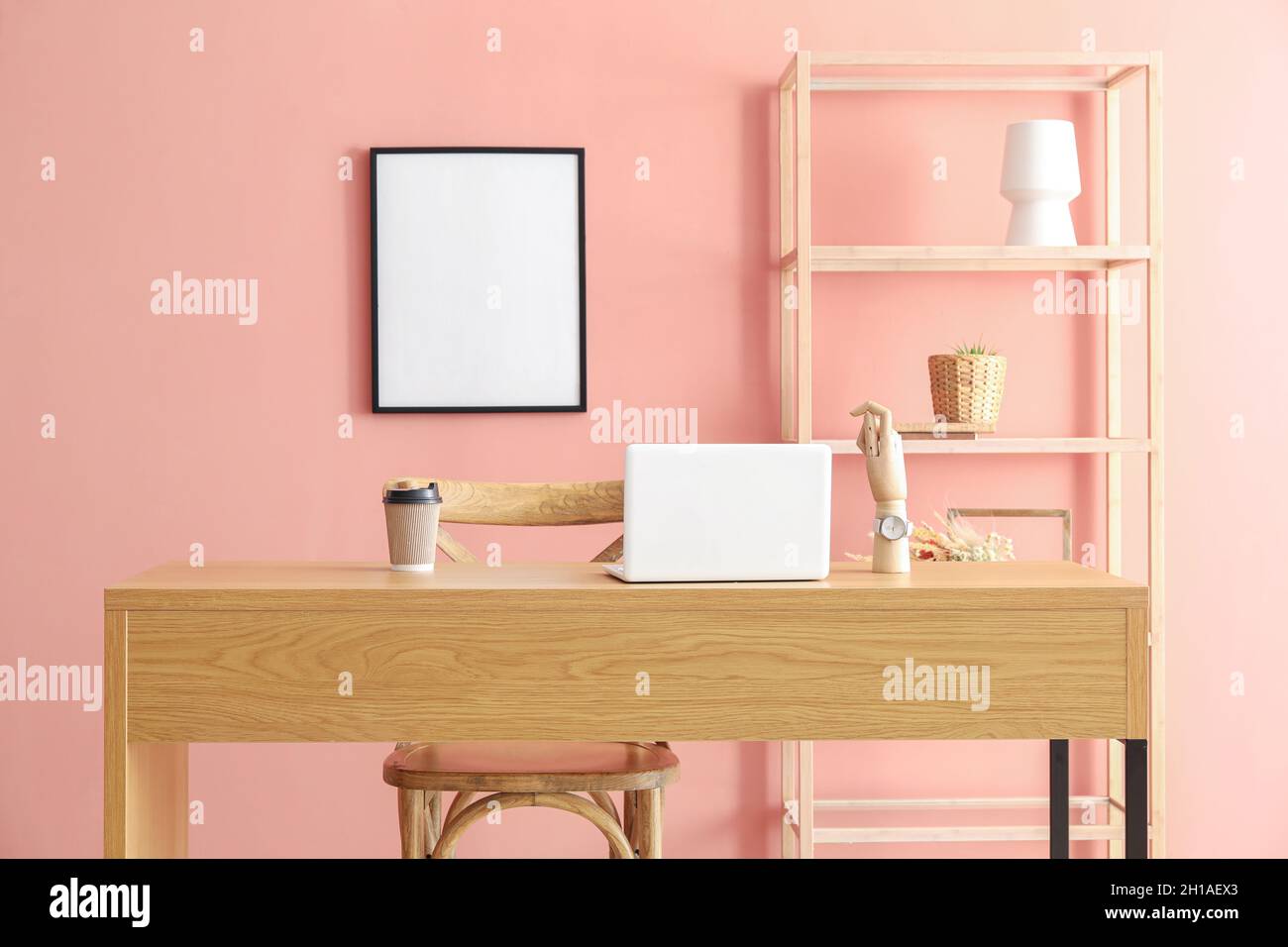 Interior of modern room with workplace near color wall Stock Photo - Alamy