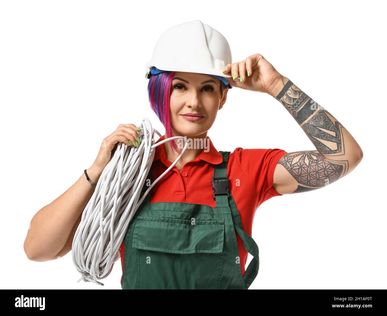 Female electrician with cables on white background Stock Photo - Alamy