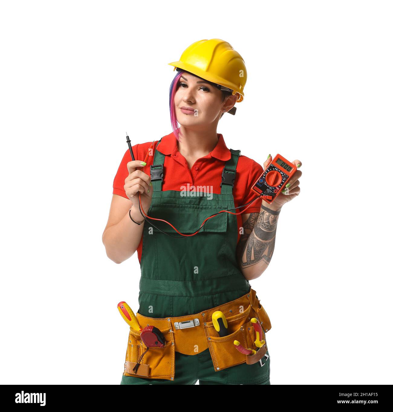 Female electrician with multimeter on white background Stock Photo - Alamy