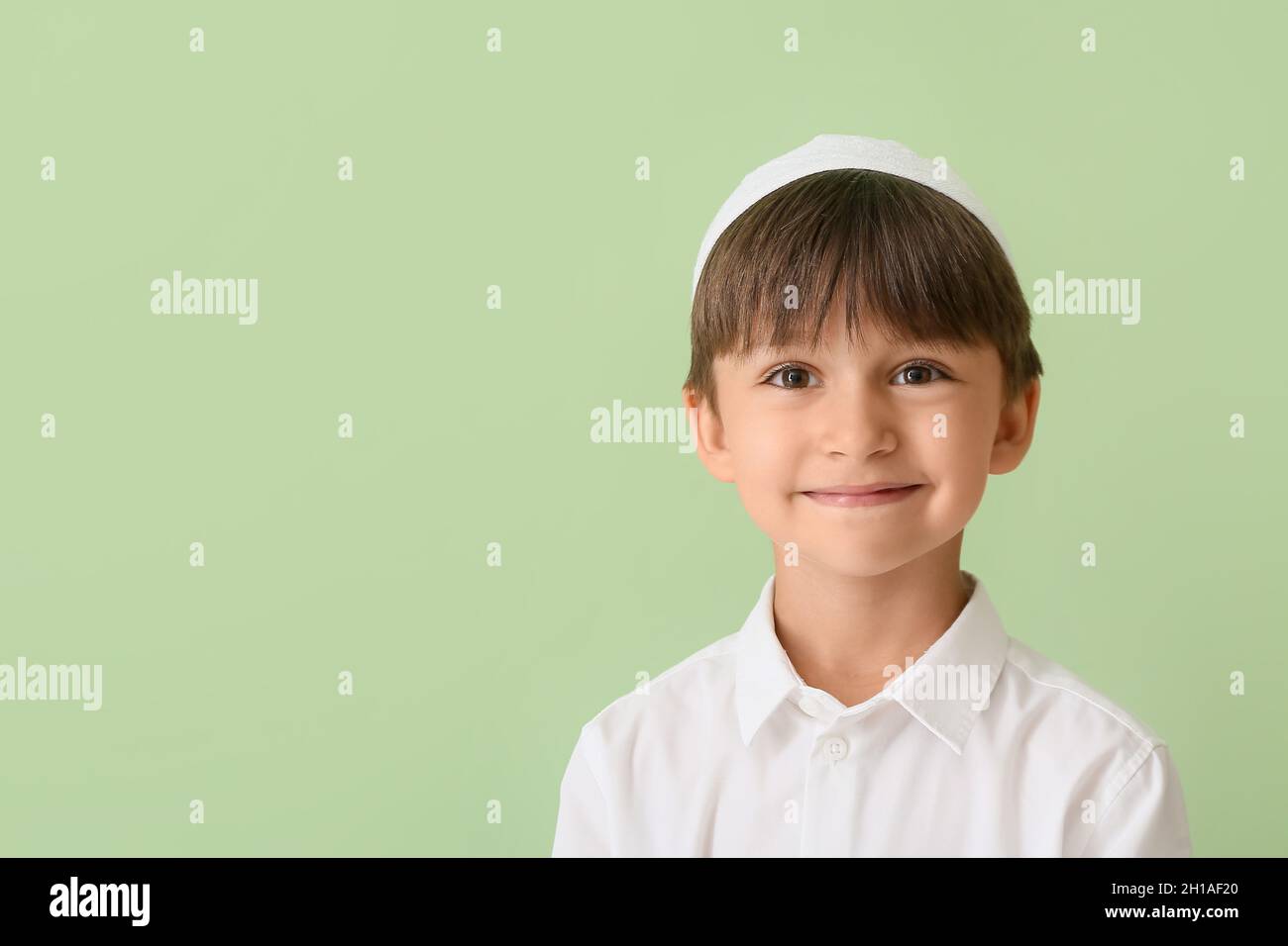 Muslim boy on color background Stock Photo - Alamy