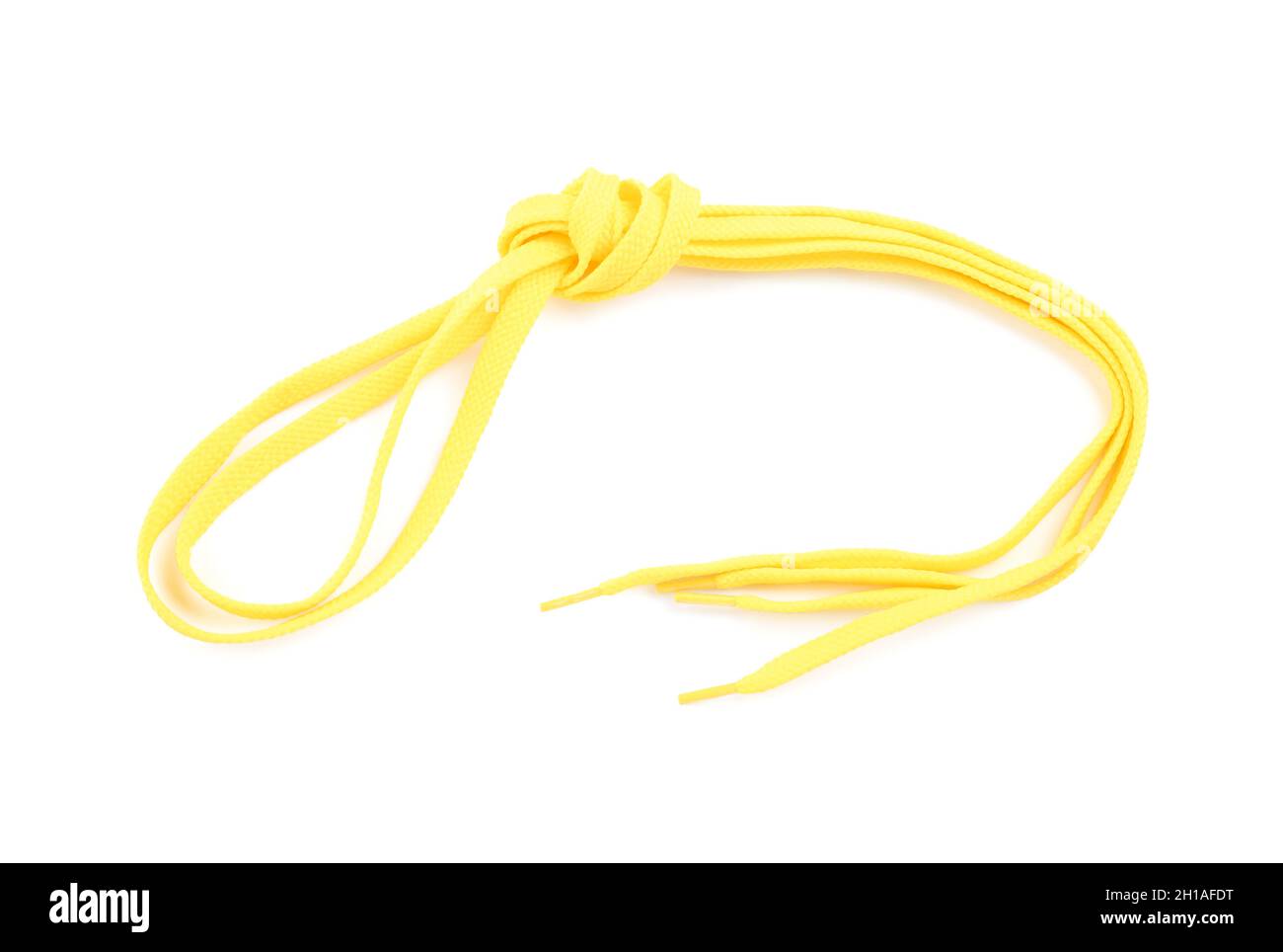 Yellow shoe laces tied in knot on white background Stock Photo - Alamy