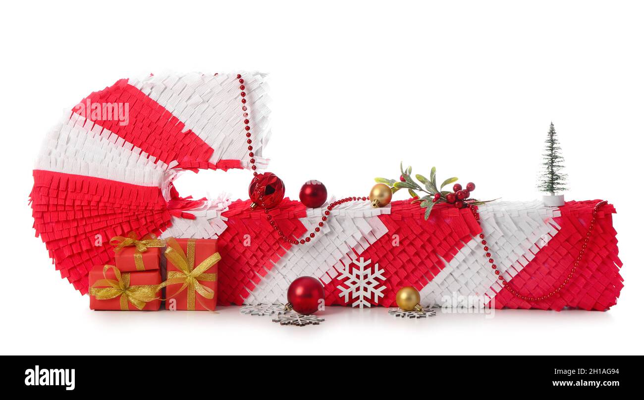 Candy cane pinata with gifts and balls on white background Stock Photo ...
