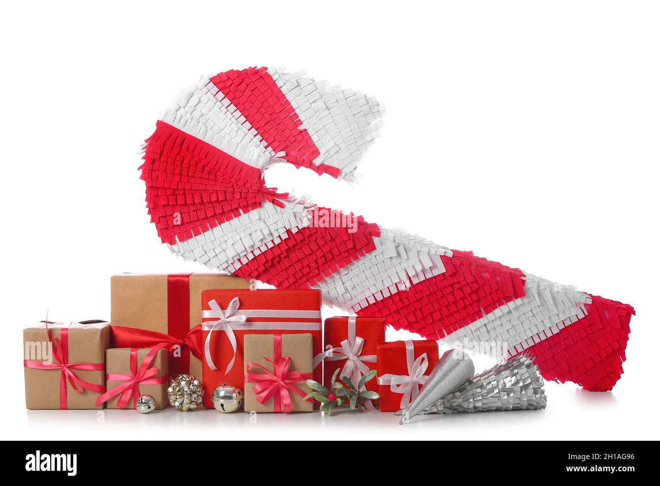 Candy cane pinata with gifts on white background Stock Photo - Alamy