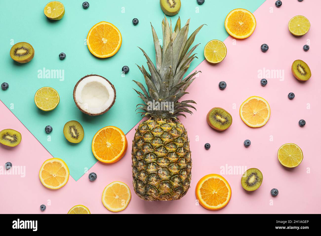 Composition with ripe pineapple ad fruits on color background Stock ...